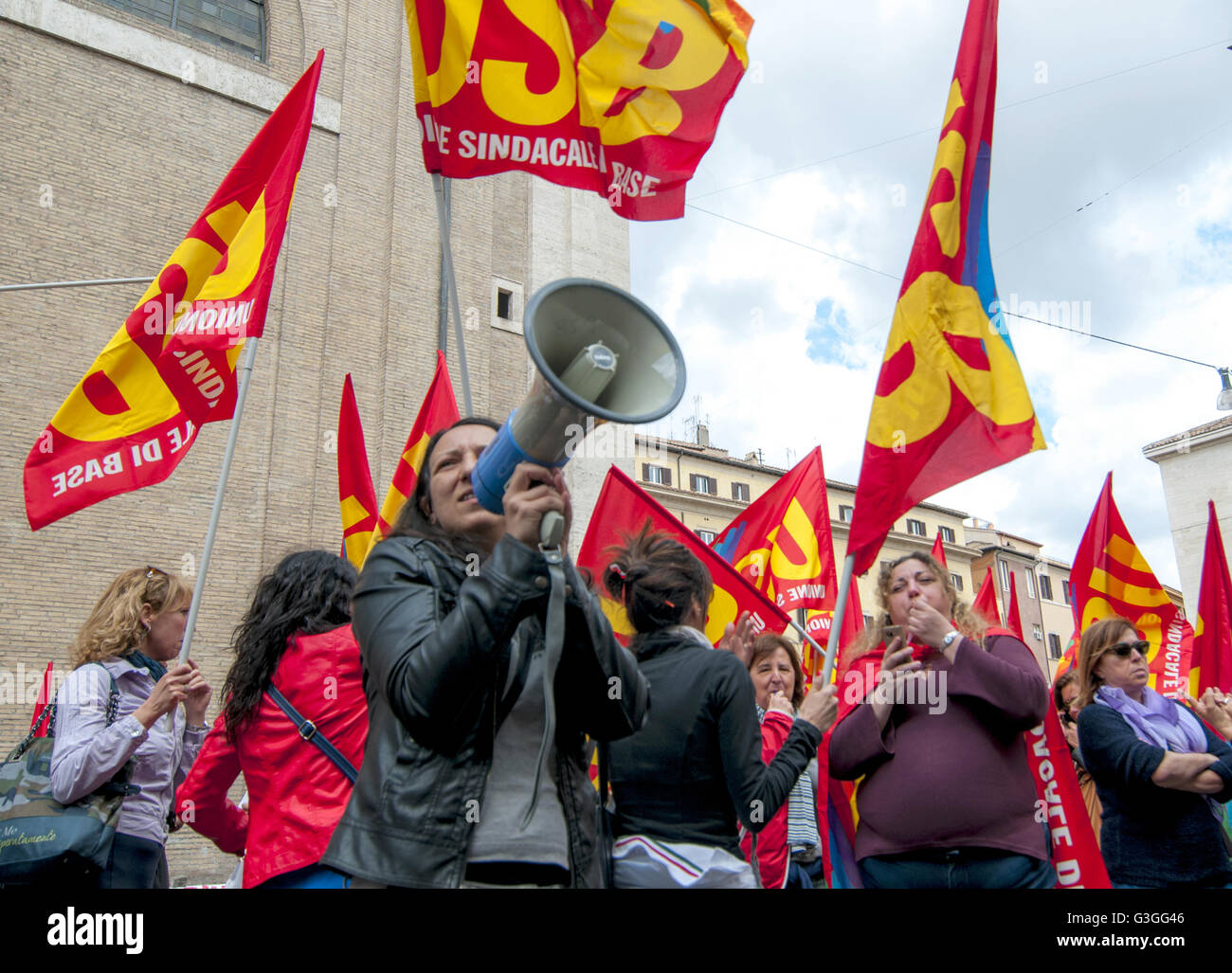 A woman using mega phone during strike in Rome. Strike of school and ...