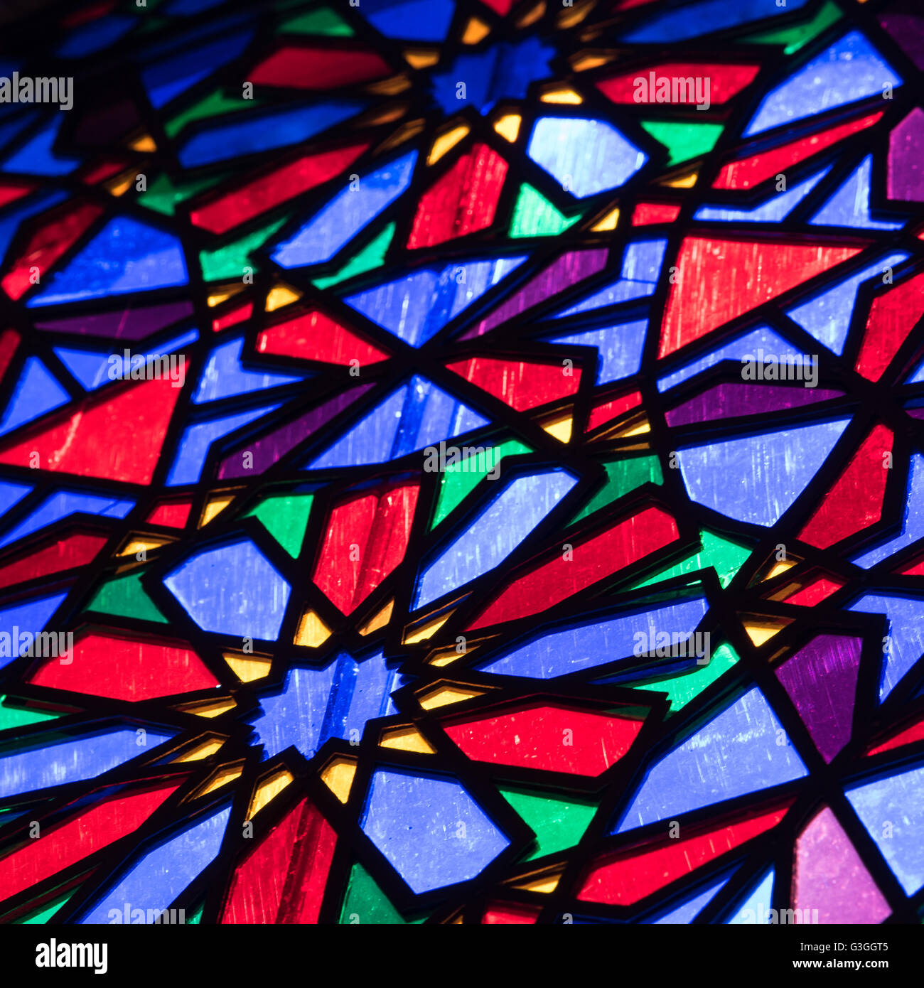 Image of a multicolored stained glass window with irregular block ...