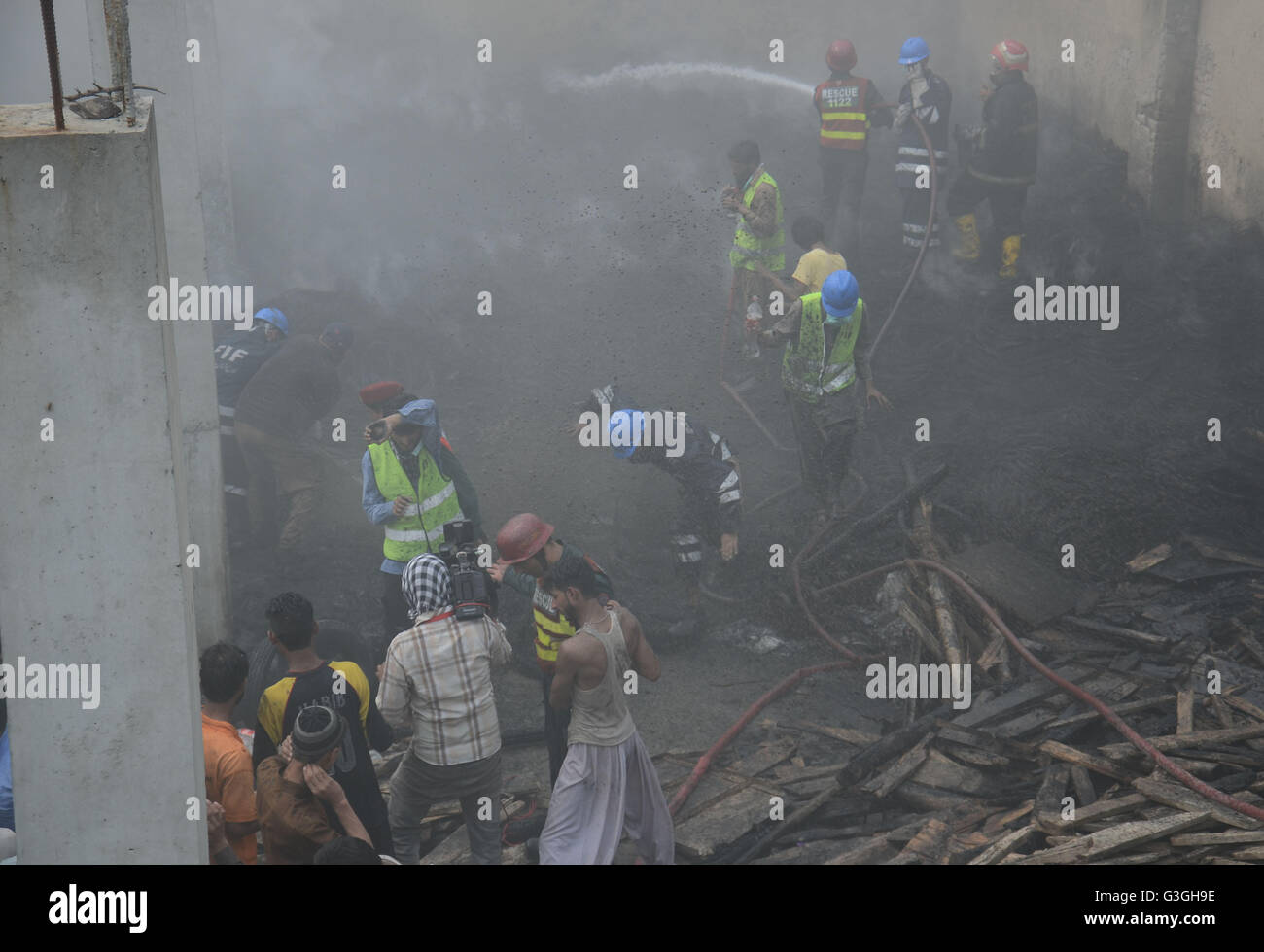 Lahore, Pakistan. 08th May, 2016. Pakistani firefighters extinguishing ...