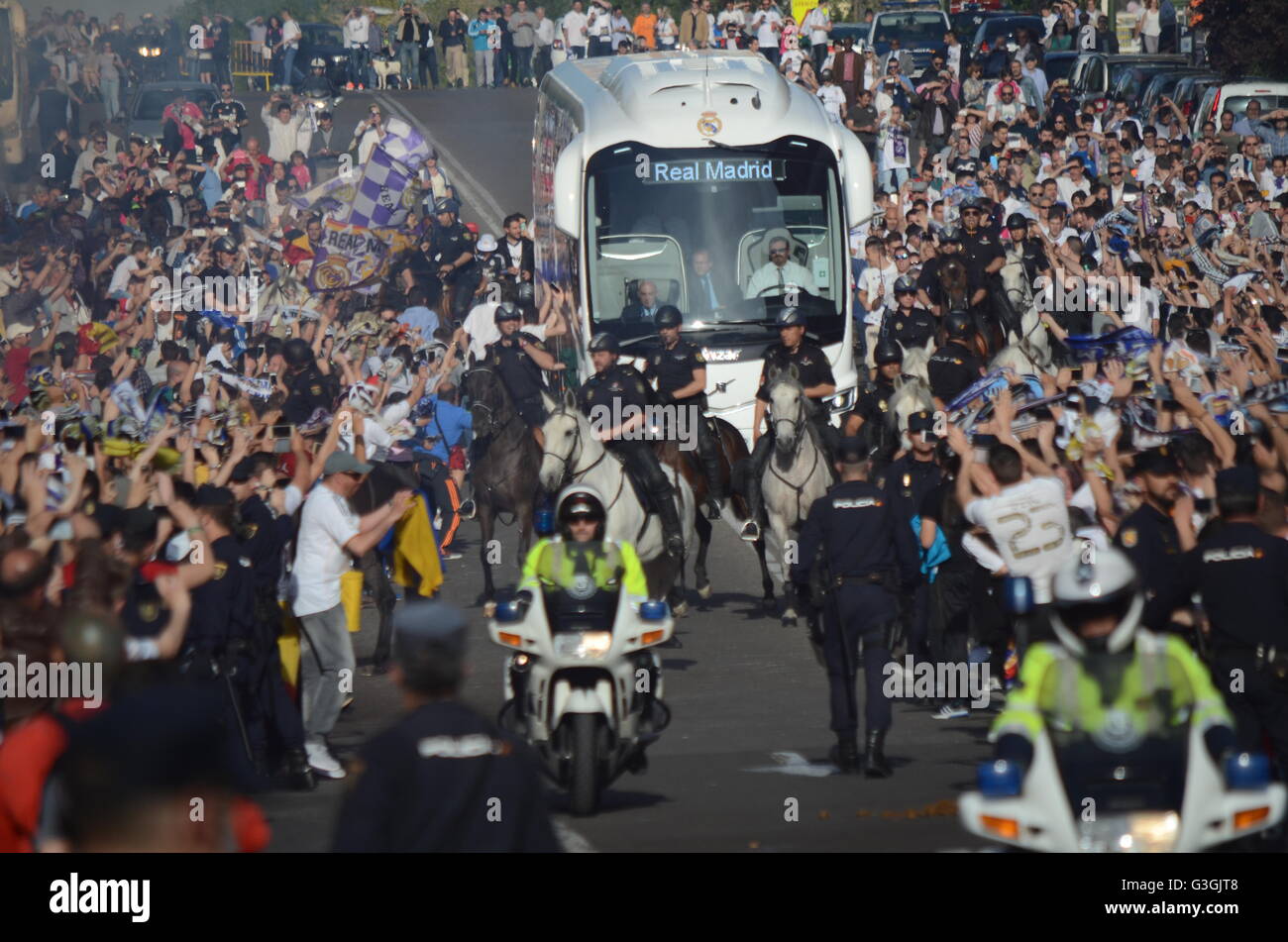 Real Madrid fans cheer as the players arrive at the Santiago Bernabeu ...
