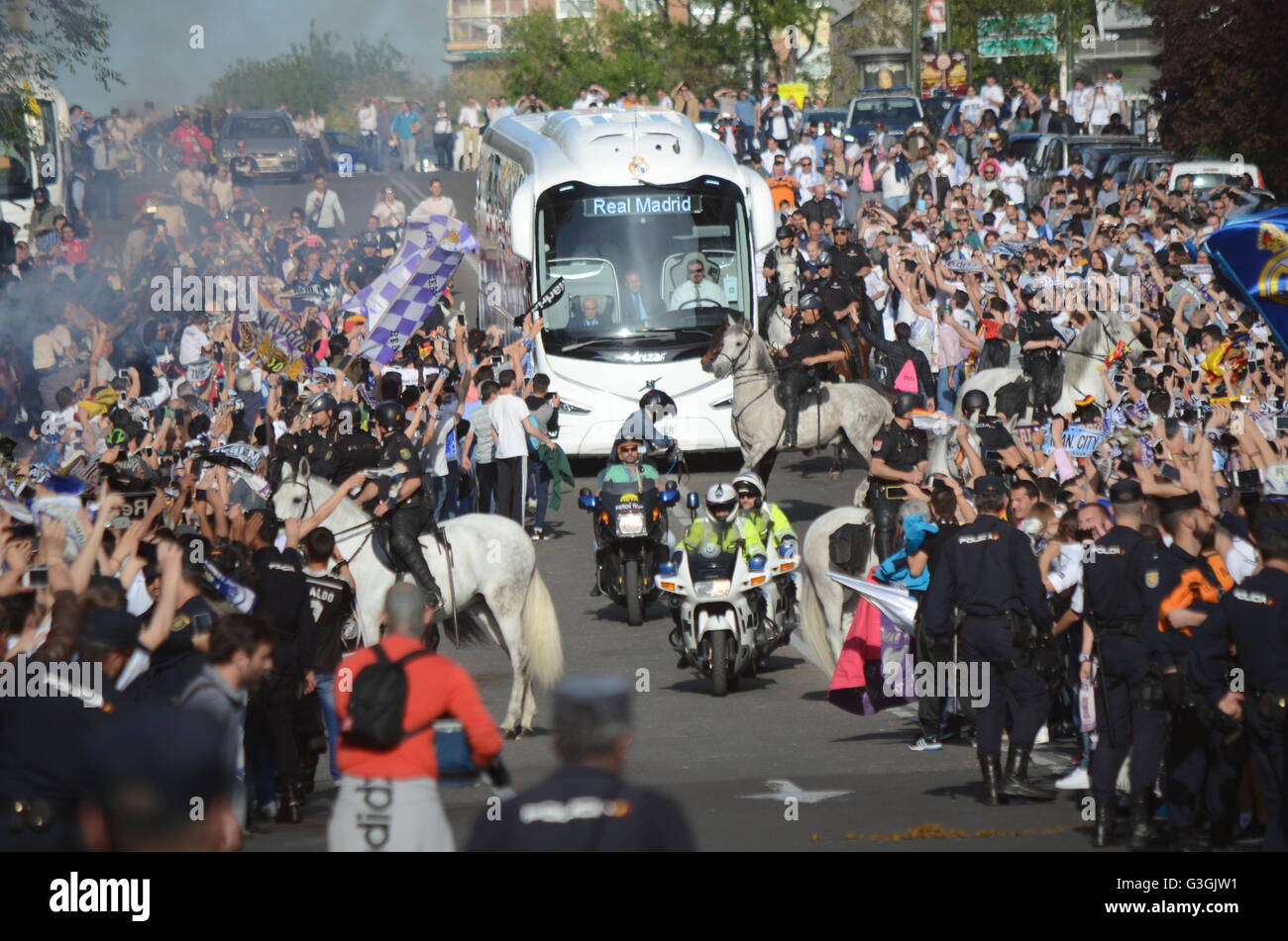 Real Madrid fans cheer as the players arrive at the Santiago Bernabeu ...