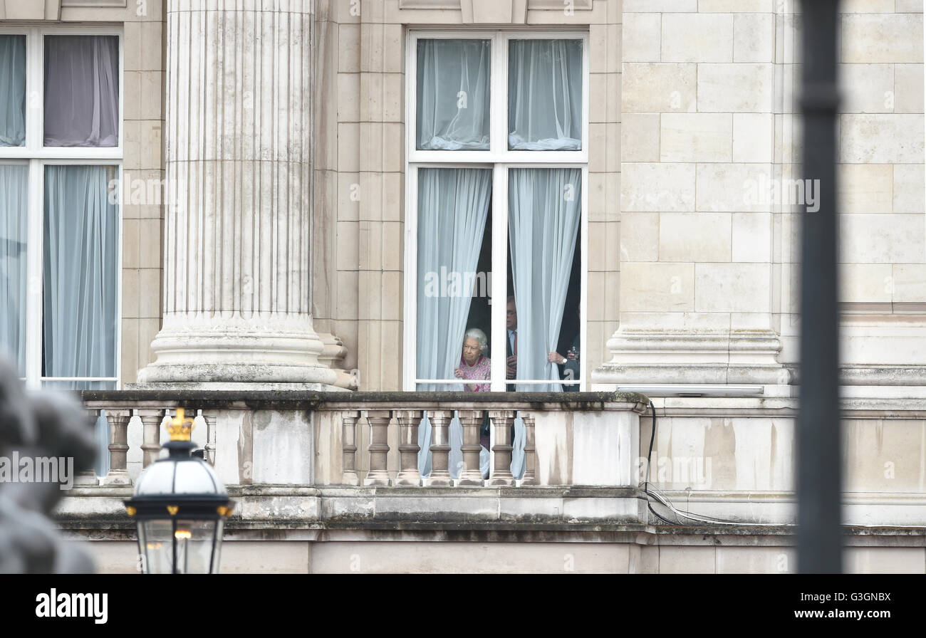 Queen Elizabeth II and the Duke of York look out from the window at ...