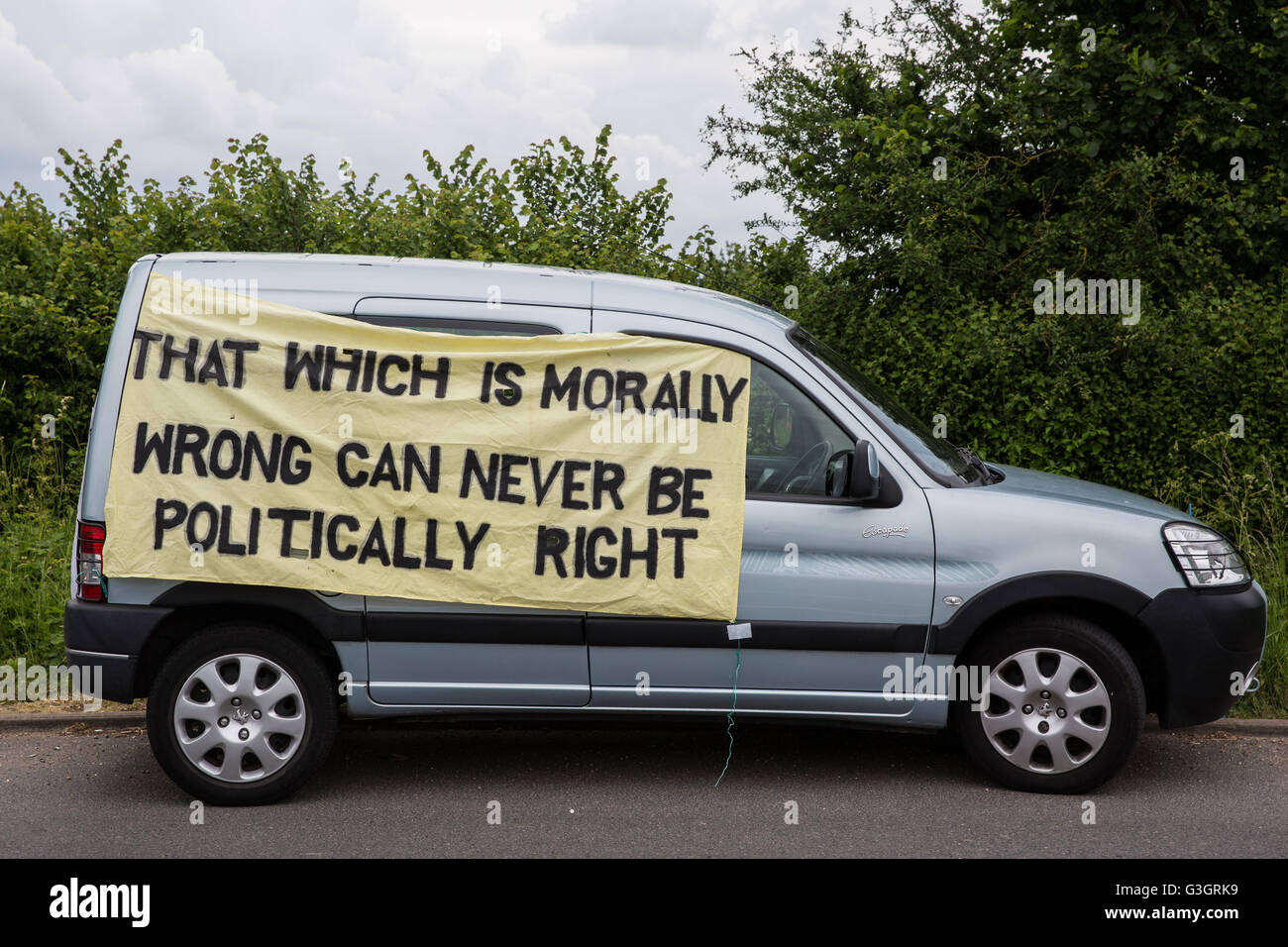 Burghfield, UK. 11th June, 2016. A vehicle with a banner carrying a ...