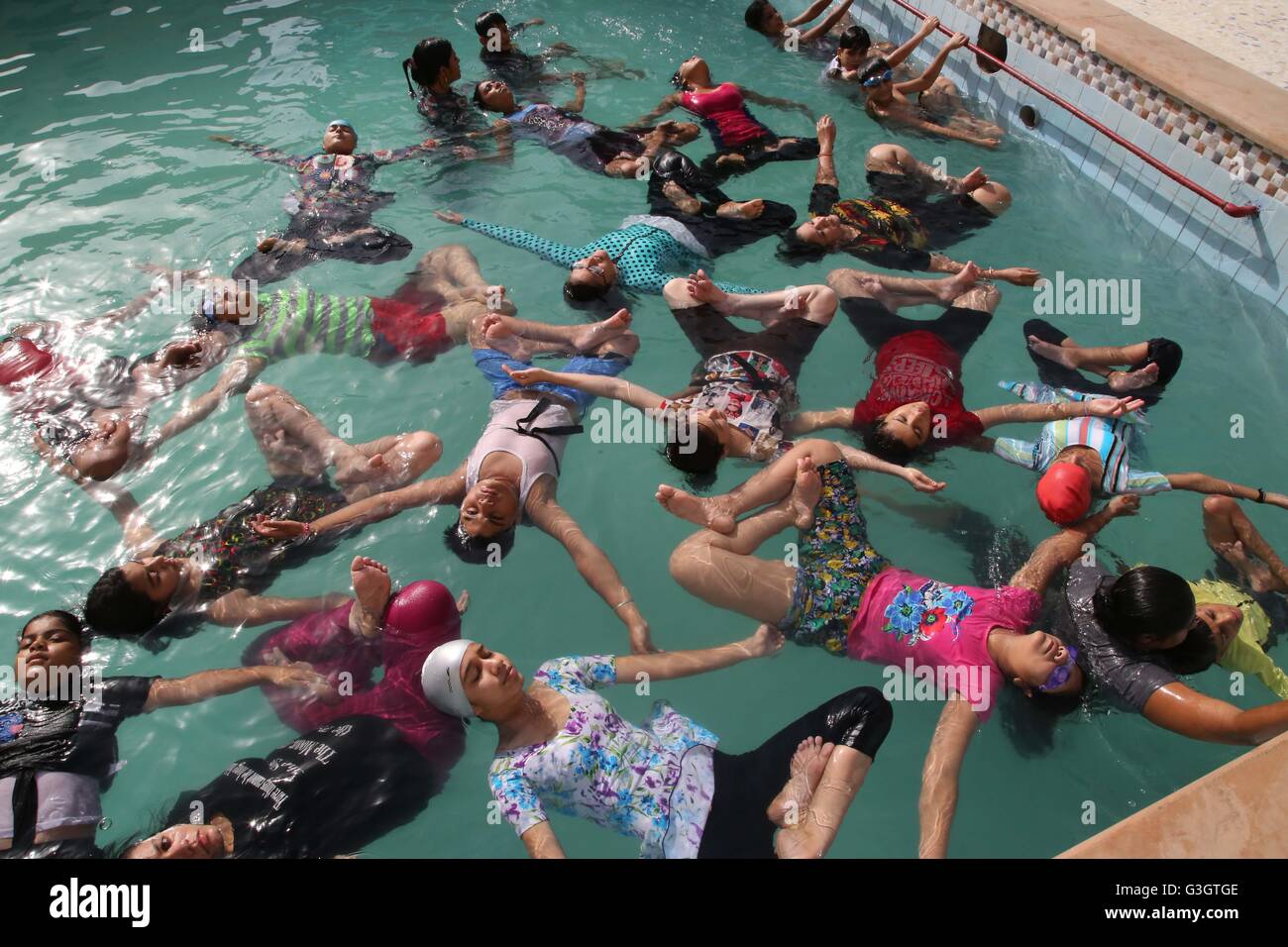 People doing of yoga in water at Dau ri Dhani swimming pool, as they ...