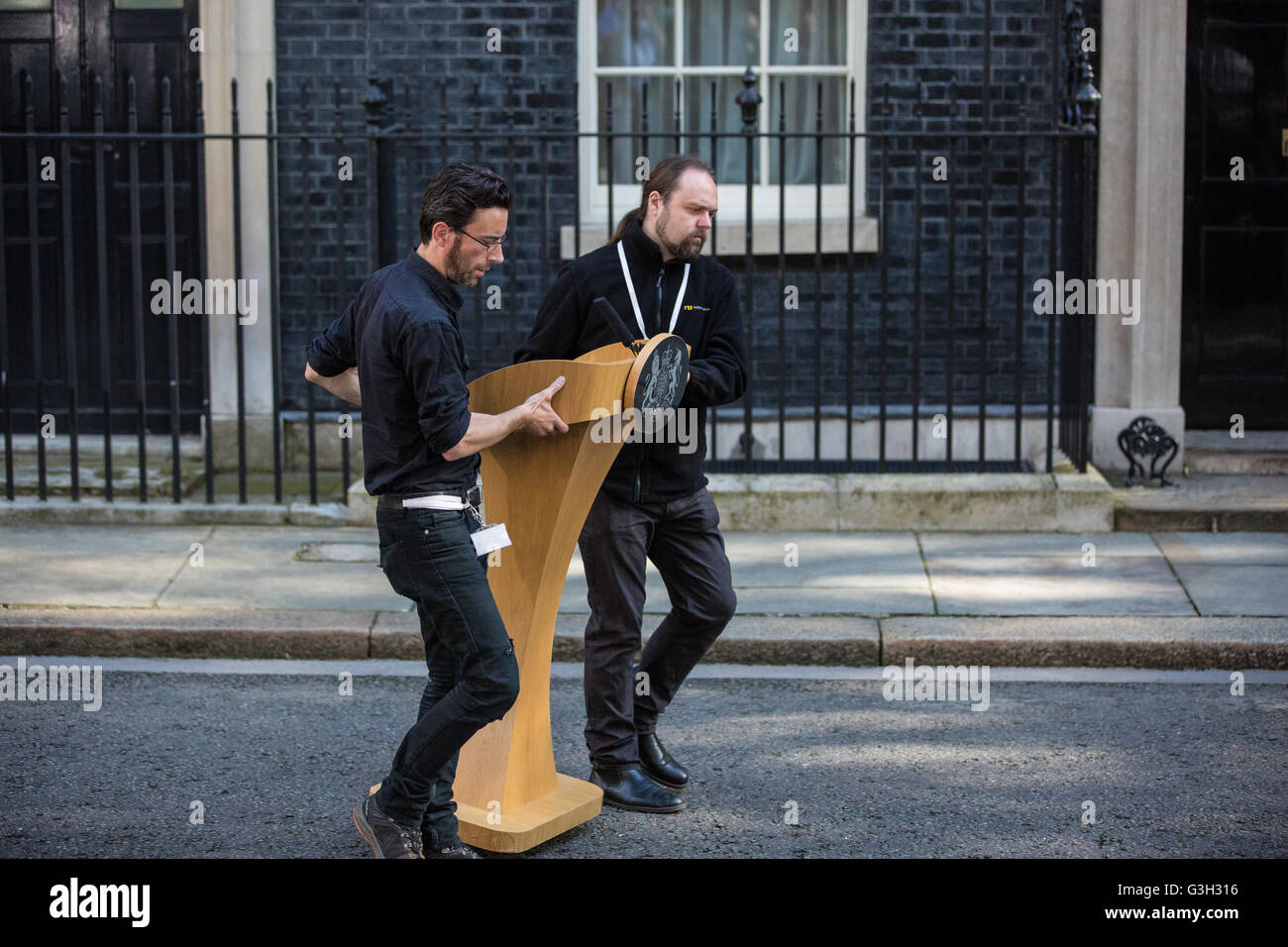London, UK. 24th June, 2016. Members of staff carry a lectern to be ...