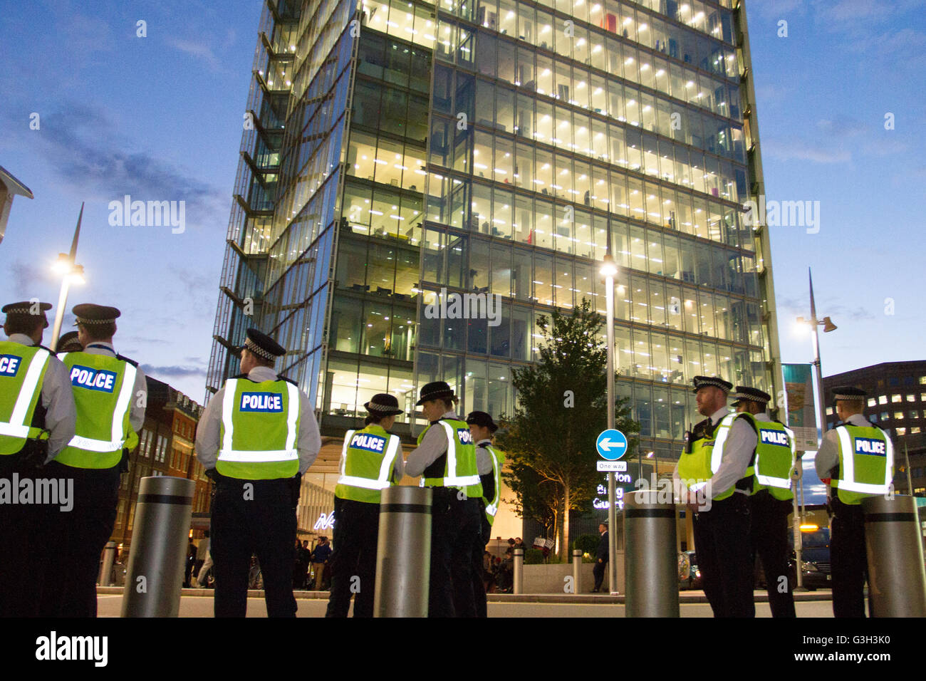 London, England. 24th June 2016. Police stand guard outside News UK ...