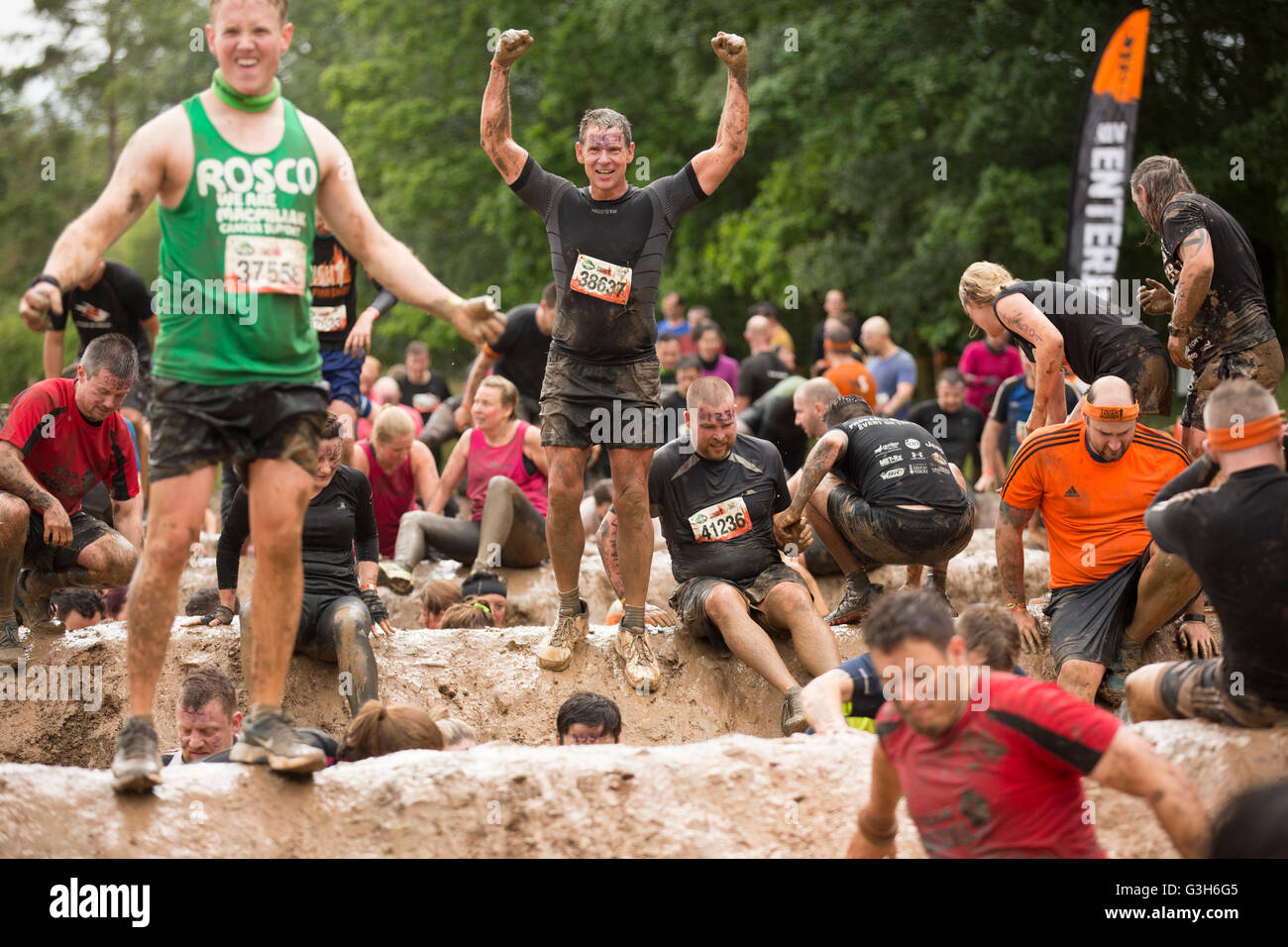 Tough Mudder obstacle course, competitors on the Mile of Mud obstacle ...