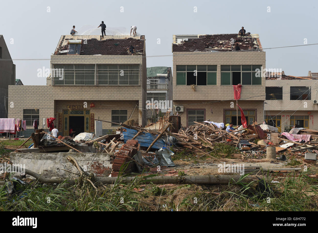 Yancheng, China's Jiangsu Province. 25th June, 2016. Villagers repair ...