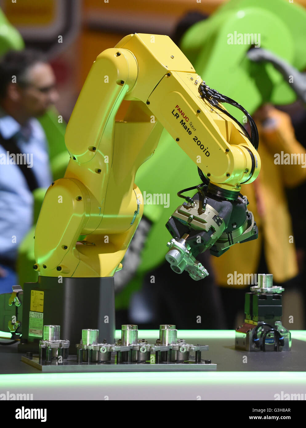 Munich, Germany. 21st June, 2016. A robot moves metal parts on the ...