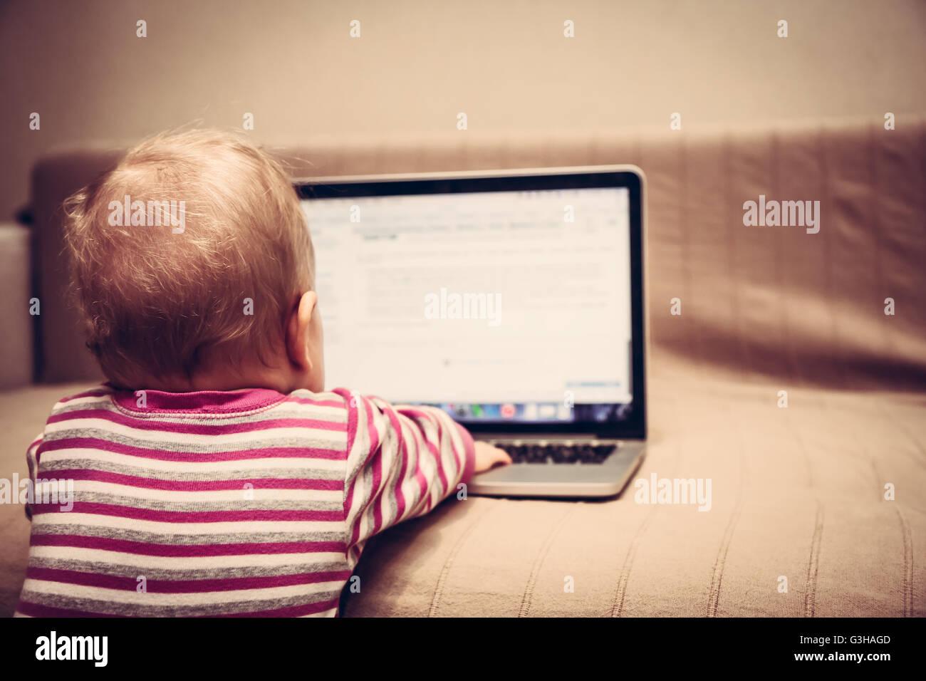 Child working at computer hi-res stock photography and images - Alamy