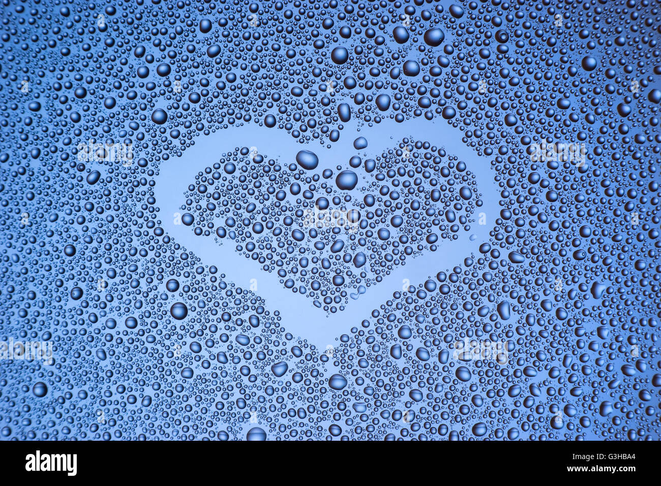 Blue water droplet background Stock Photo - Alamy