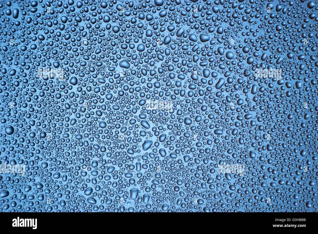 Blue water droplet background Stock Photo - Alamy