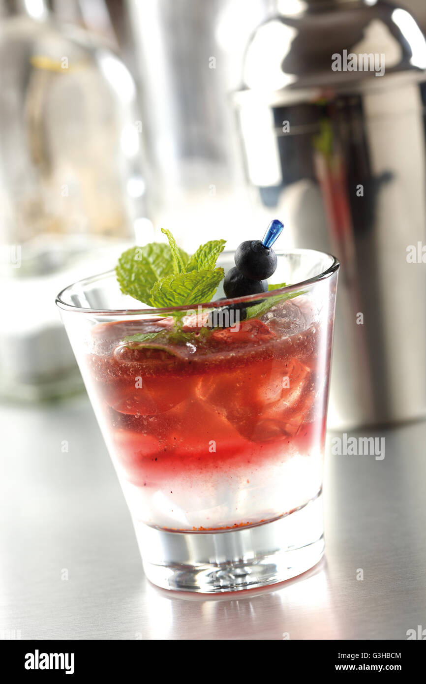 Blueberry cocktail, prepared with lemon, lime, blueberries and vodka ...