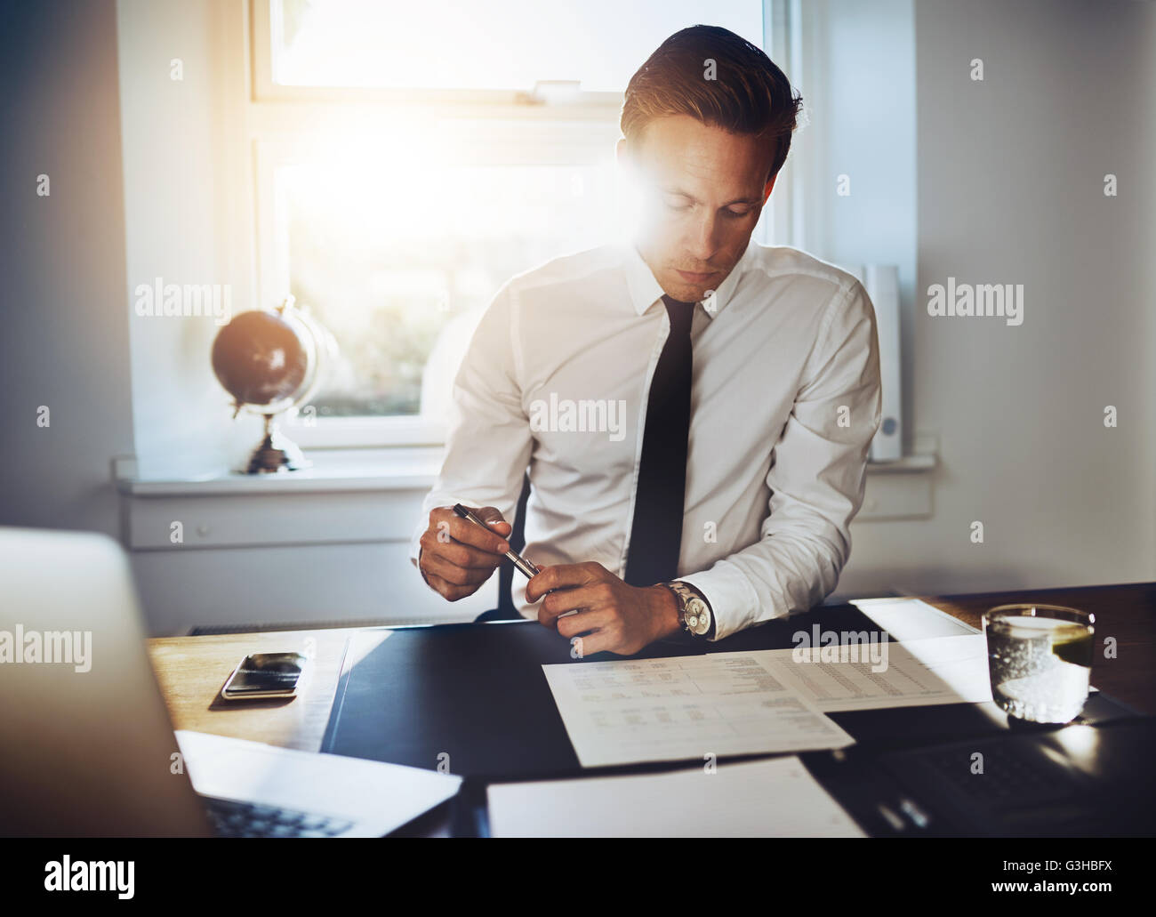 Executive business man working at desk in a classic office while ...