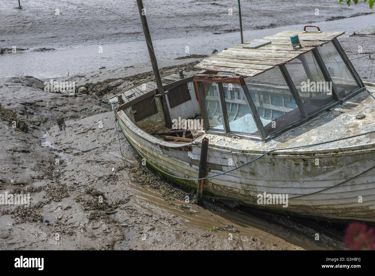 Sinking boat concept. Boat as a visual metaphor for washed up, beached ...