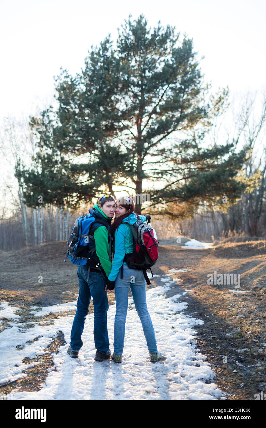 Hiking couple in spring forest. Outdoor adventures concept Stock Photo ...