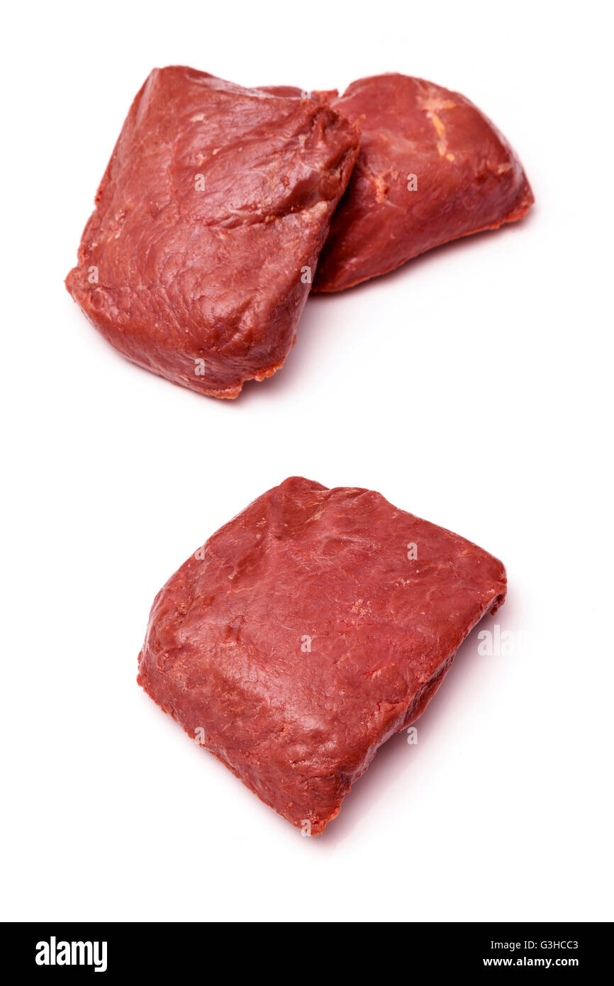 Cooked Ostrich (Struthio camelus) meat steaks isolated on a white ...