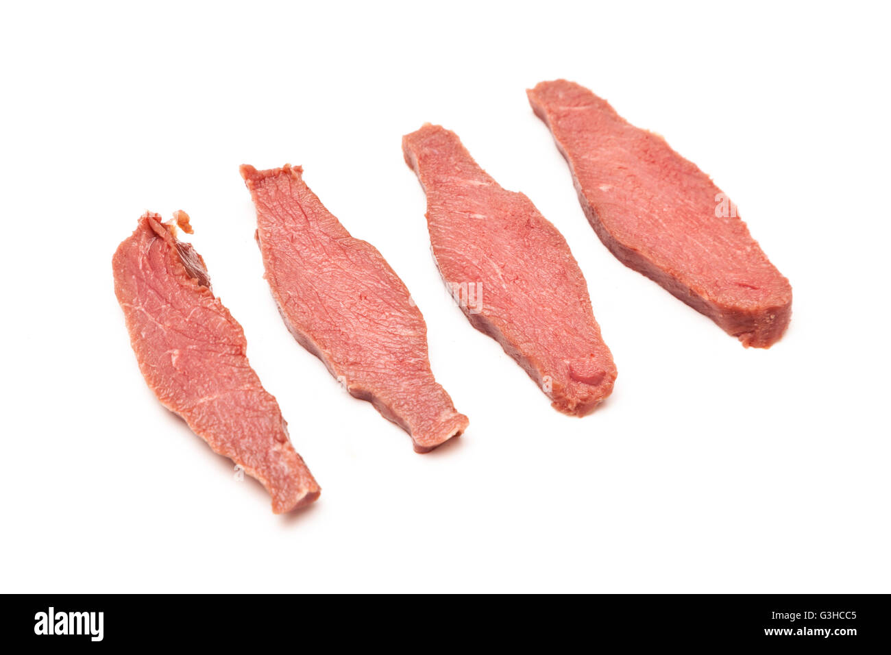 Cooked Ostrich (Struthio camelus) meat steaks isolated on a white ...