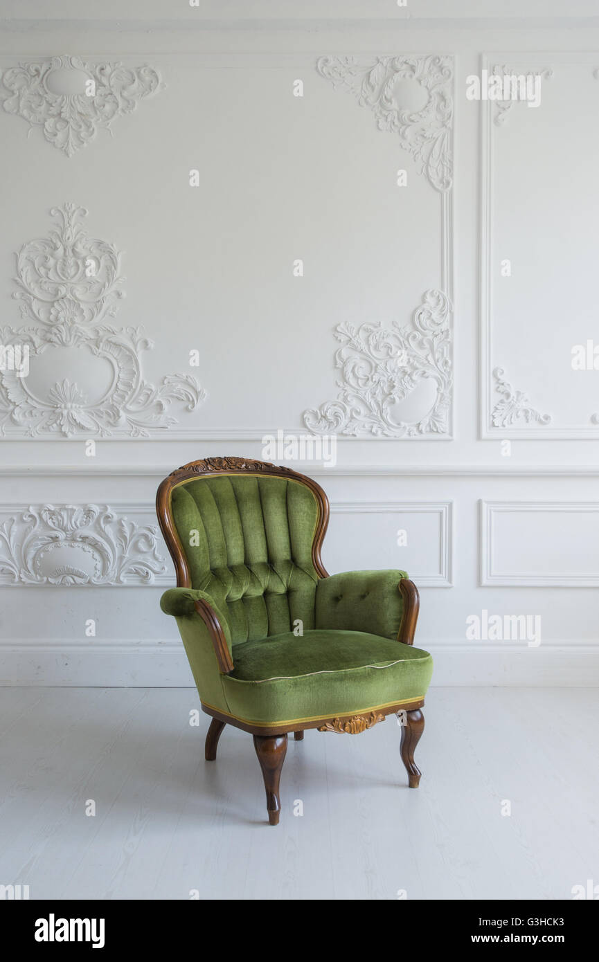 One classic armchair against a white wall and floor. Copy space Stock ...