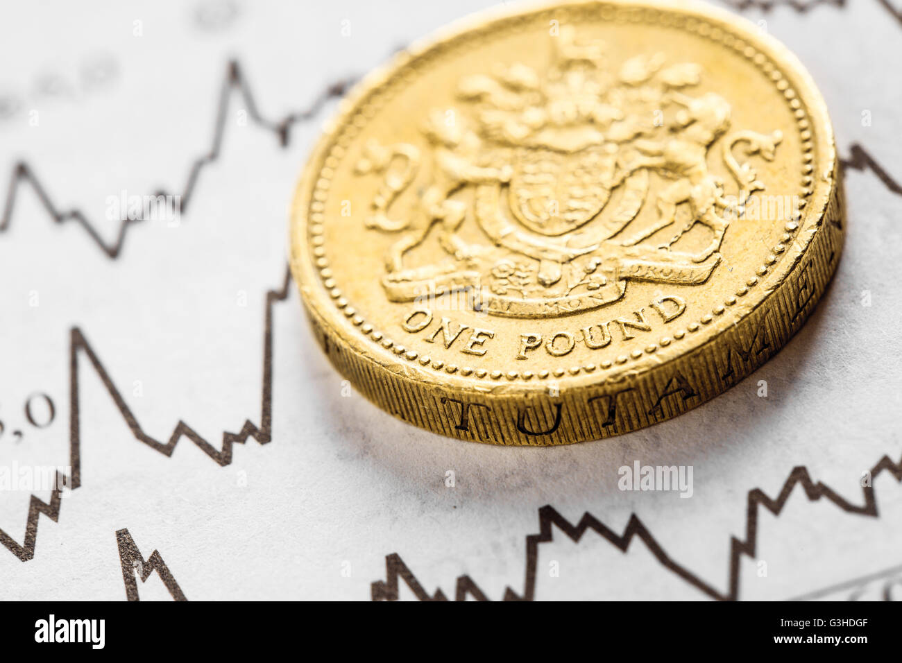 The coin one pound on graphics background Stock Photo - Alamy