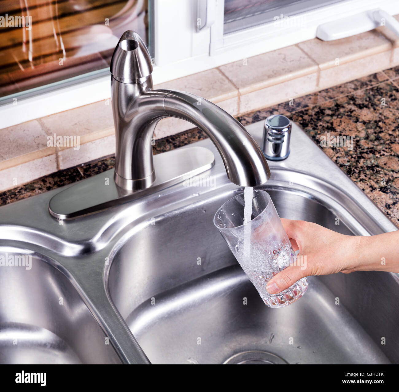 Hand water glass sink High Resolution Stock Photography and Images - Alamy