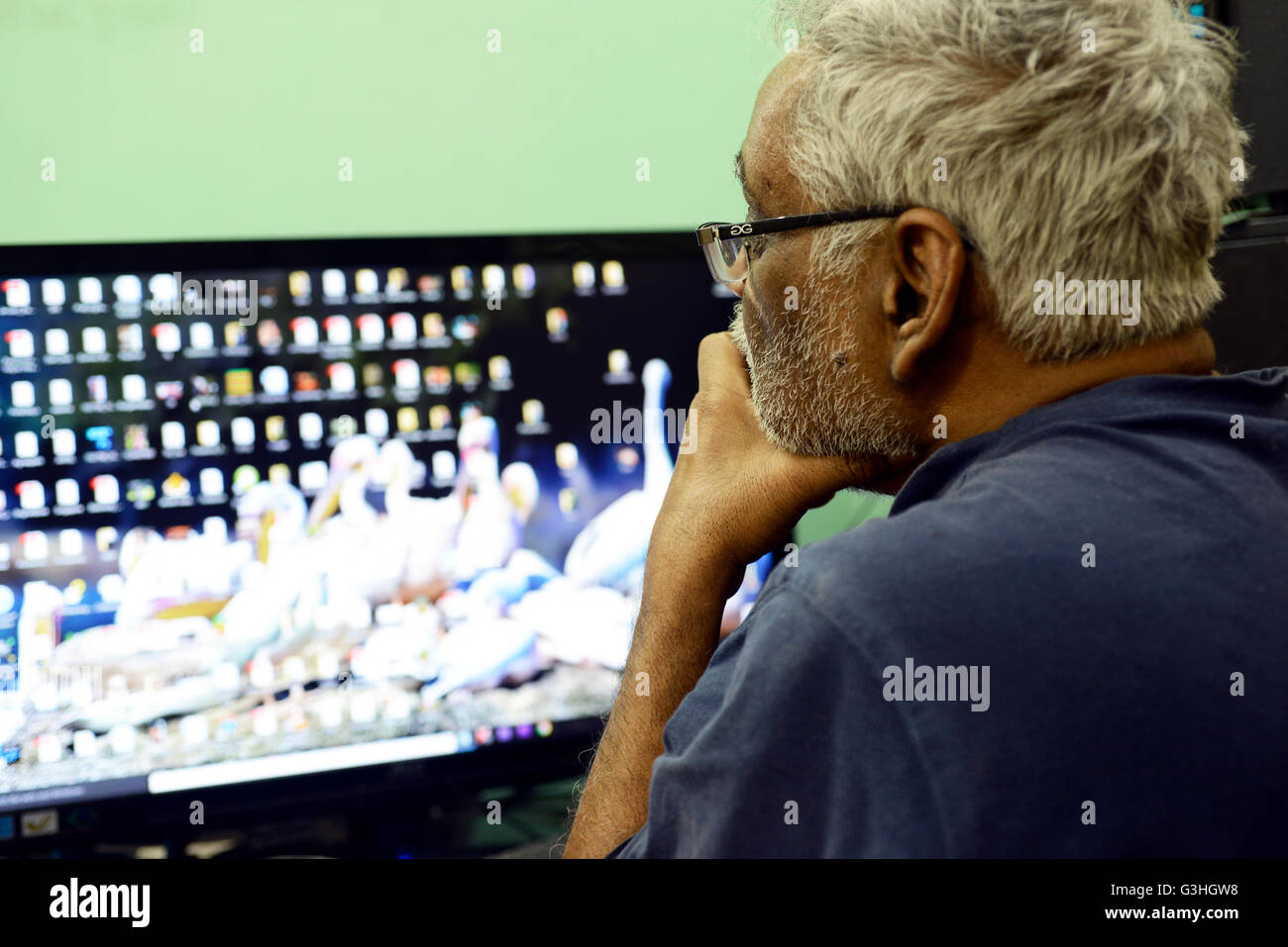 Senior Men working desktop computer at late night Stock Photo - Alamy