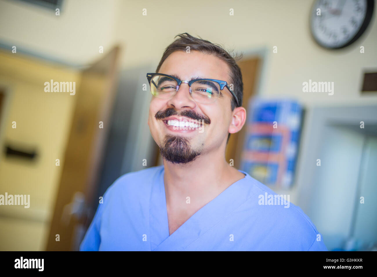 Happy hospital staff smiling Stock Photo - Alamy