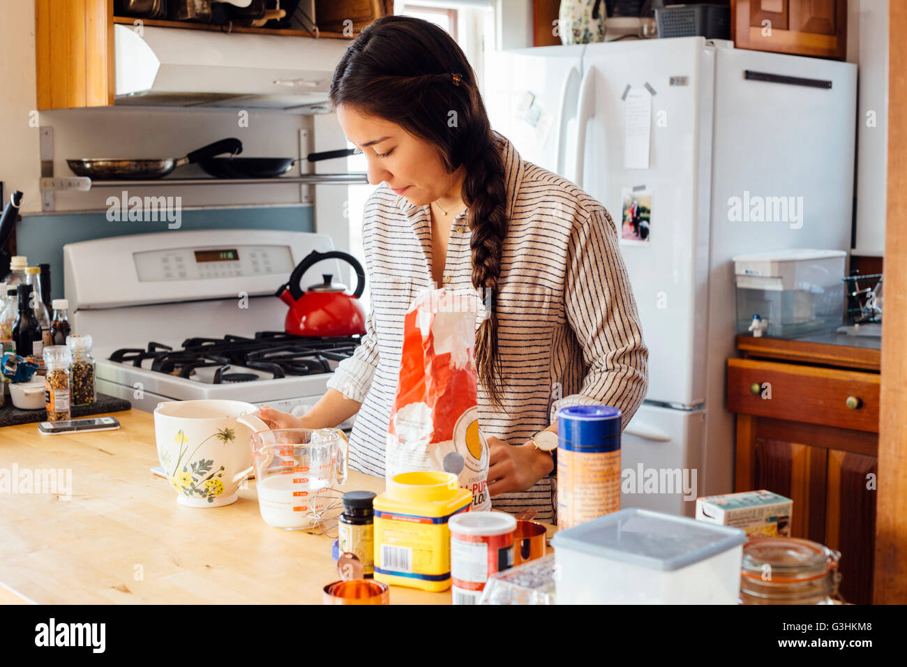 Woman in kitchen preparing waffle batter Stock Photo - Alamy