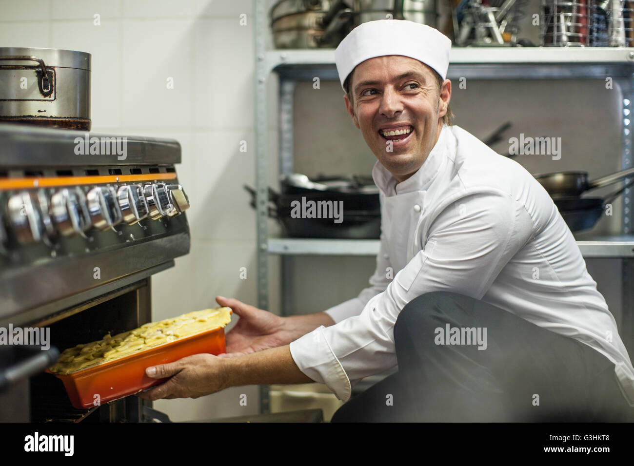 Chef baking in kitchen Stock Photo - Alamy
