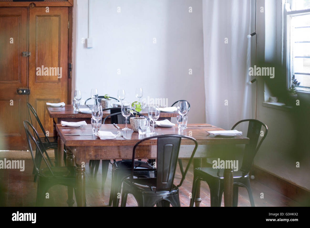 Dining table setting in restaurant Stock Photo - Alamy