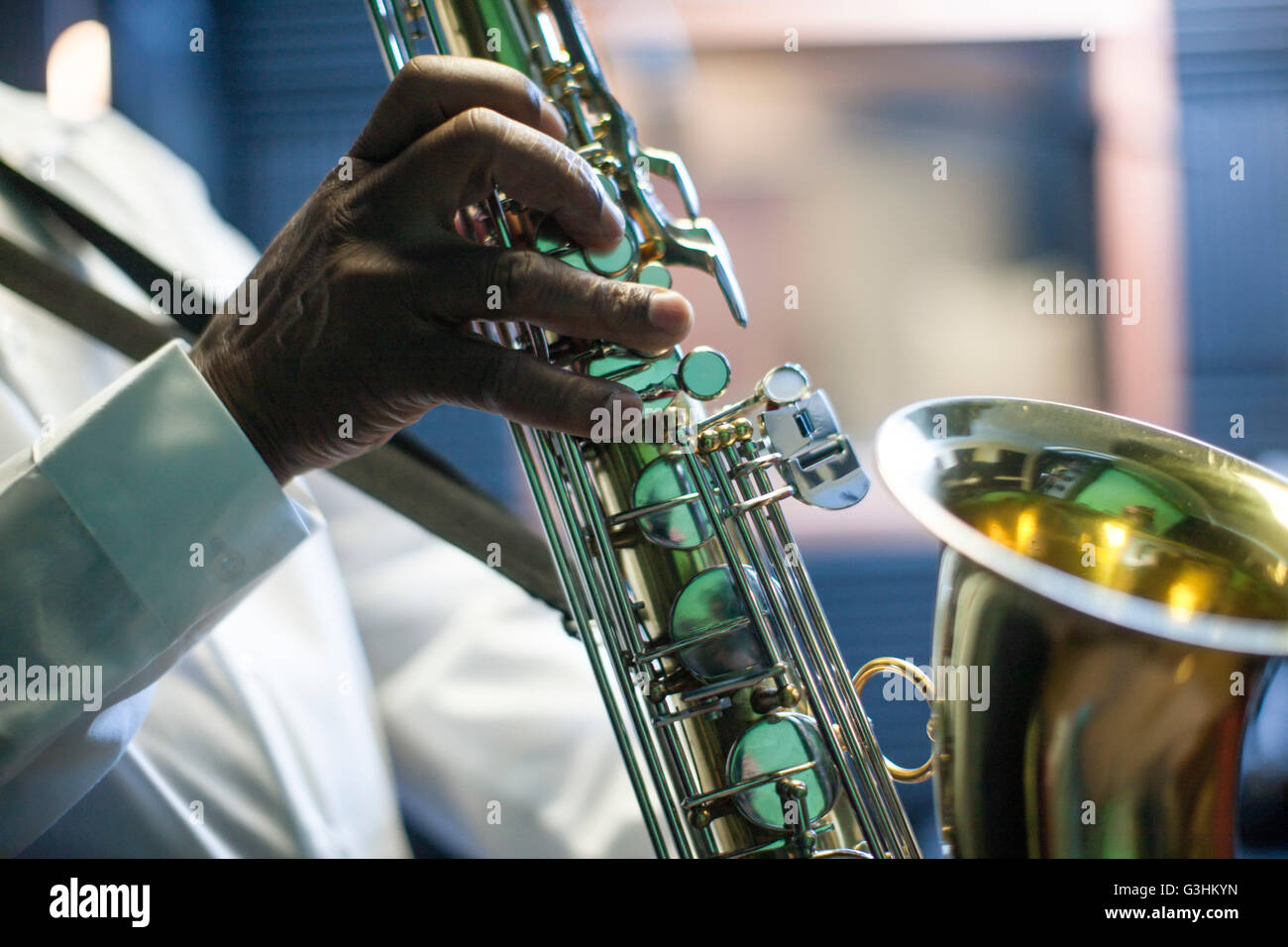 Male musician in recording studio, playing saxophone, mid section Stock ...