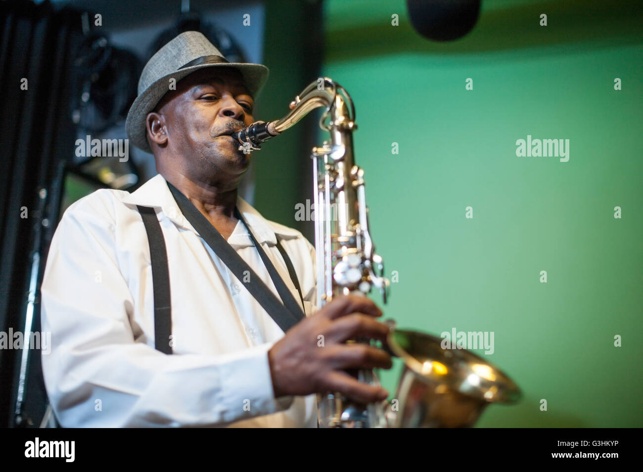 Male musician in recording studio, playing saxophone Stock Photo - Alamy