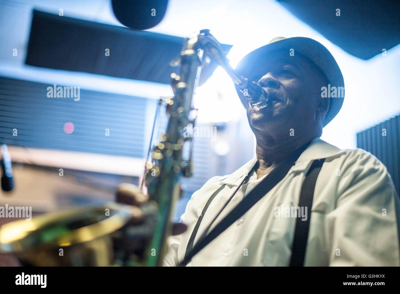 Male musician in recording studio, playing saxophone Stock Photo - Alamy