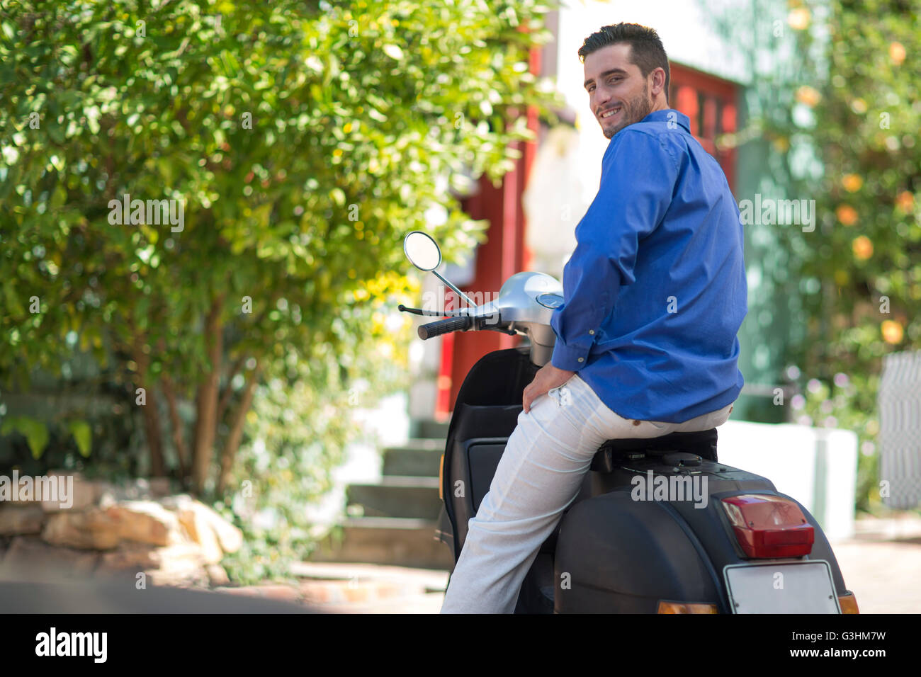 Man on moped hi-res stock photography and images - Alamy