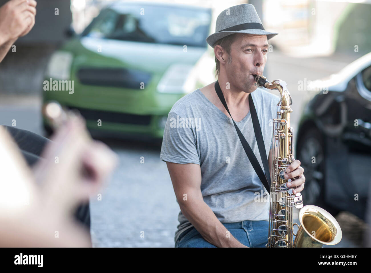 Street musician playing saxophone Stock Photo - Alamy