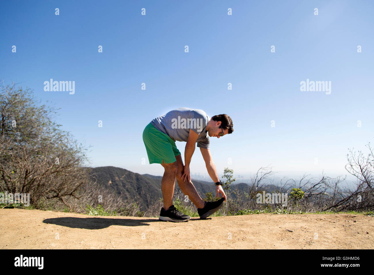 Man touching his foot hi-res stock photography and images - Alamy
