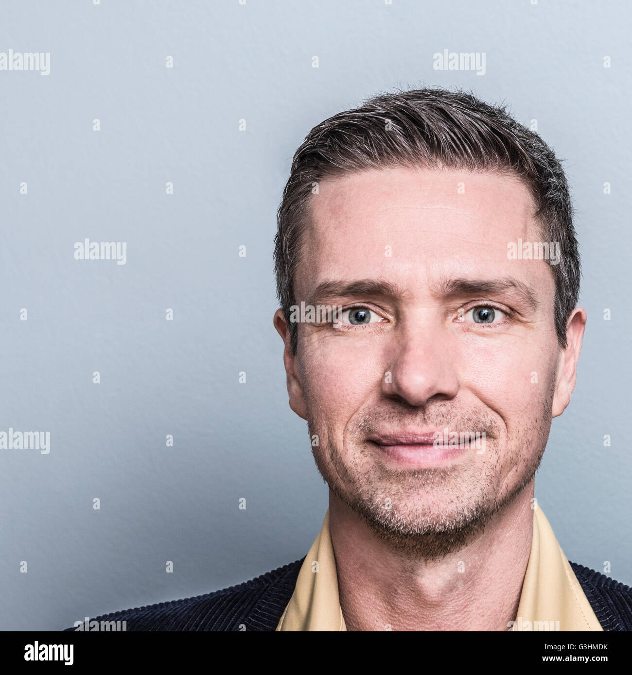 Portrait of man looking at camera smiling Stock Photo - Alamy