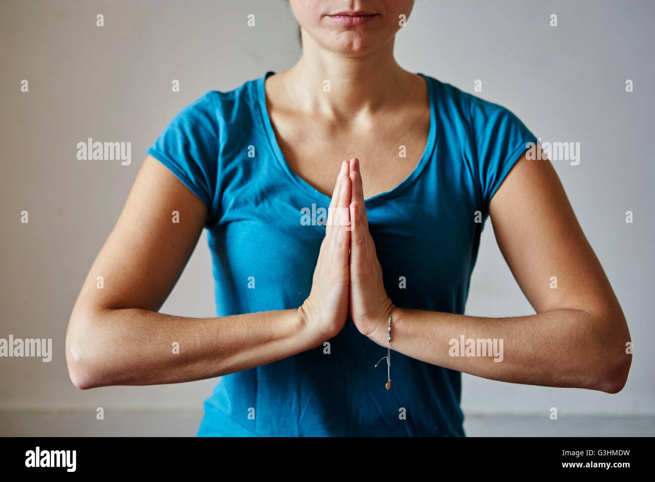 Cropped view of woman hands together meditating Stock Photo - Alamy