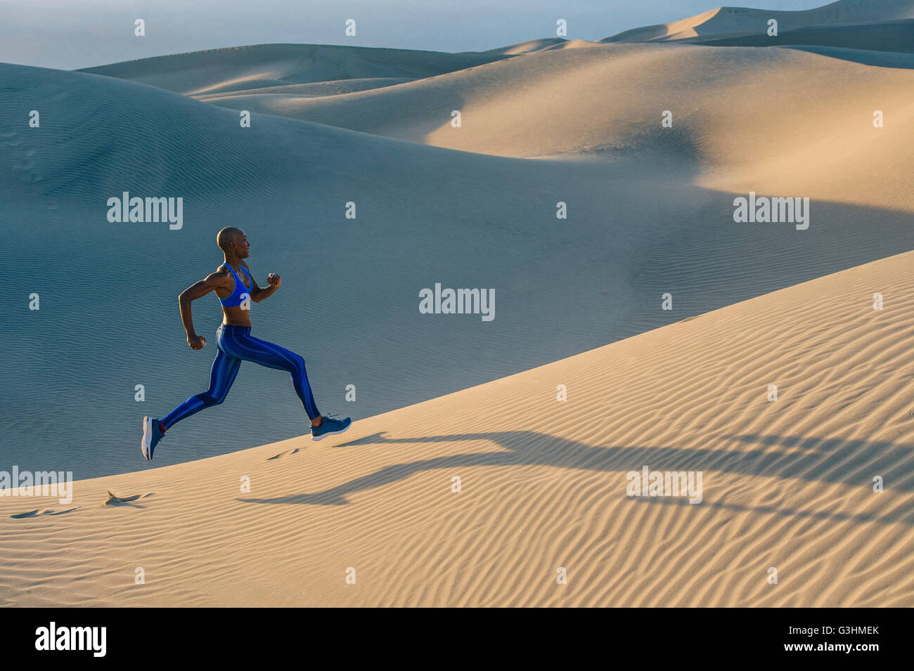 Runner sprinting in desert, Death Valley, California, USA Stock Photo ...