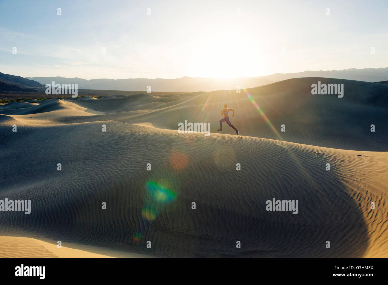 Runner sprinting in desert, Death Valley, California, USA Stock Photo ...