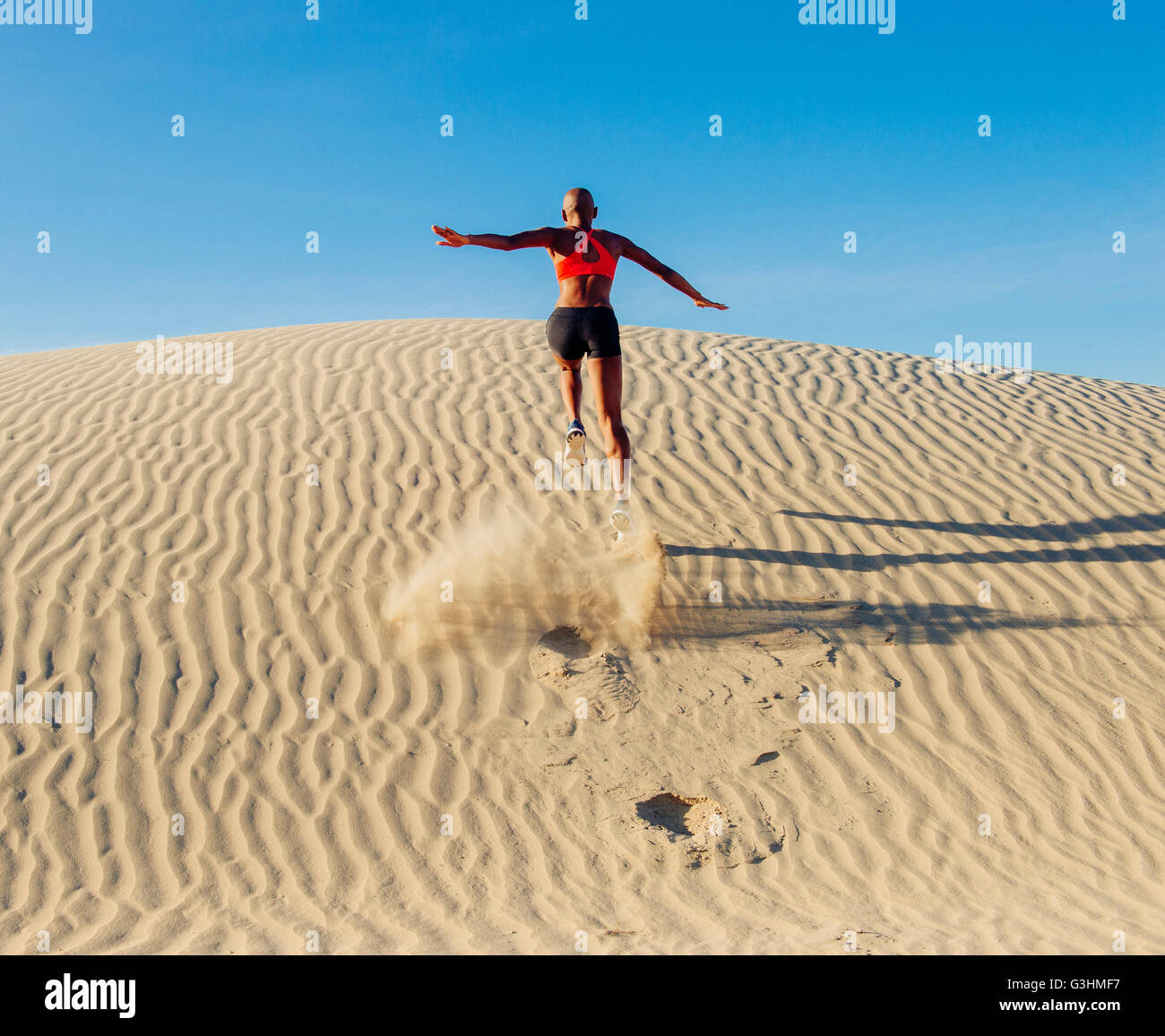 Runner sprinting in desert, Death Valley, California, USA Stock Photo ...