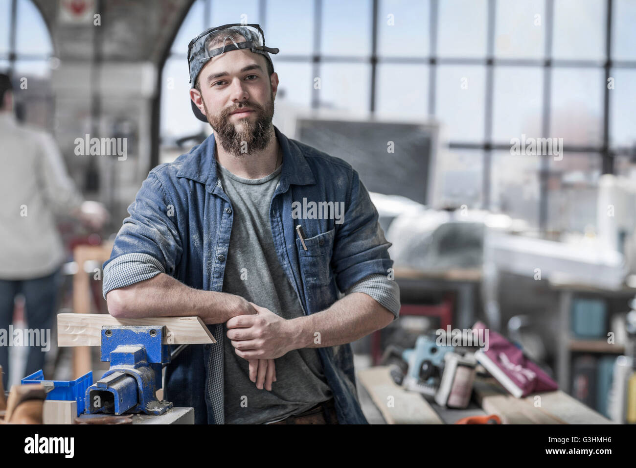 Portrait of young male carpenter in antique restoration workshop Stock ...