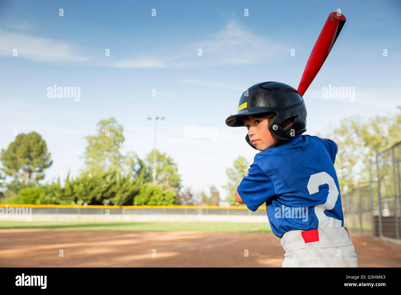 Boy preparing to bat at practise on baseball field Stock Photo - Alamy