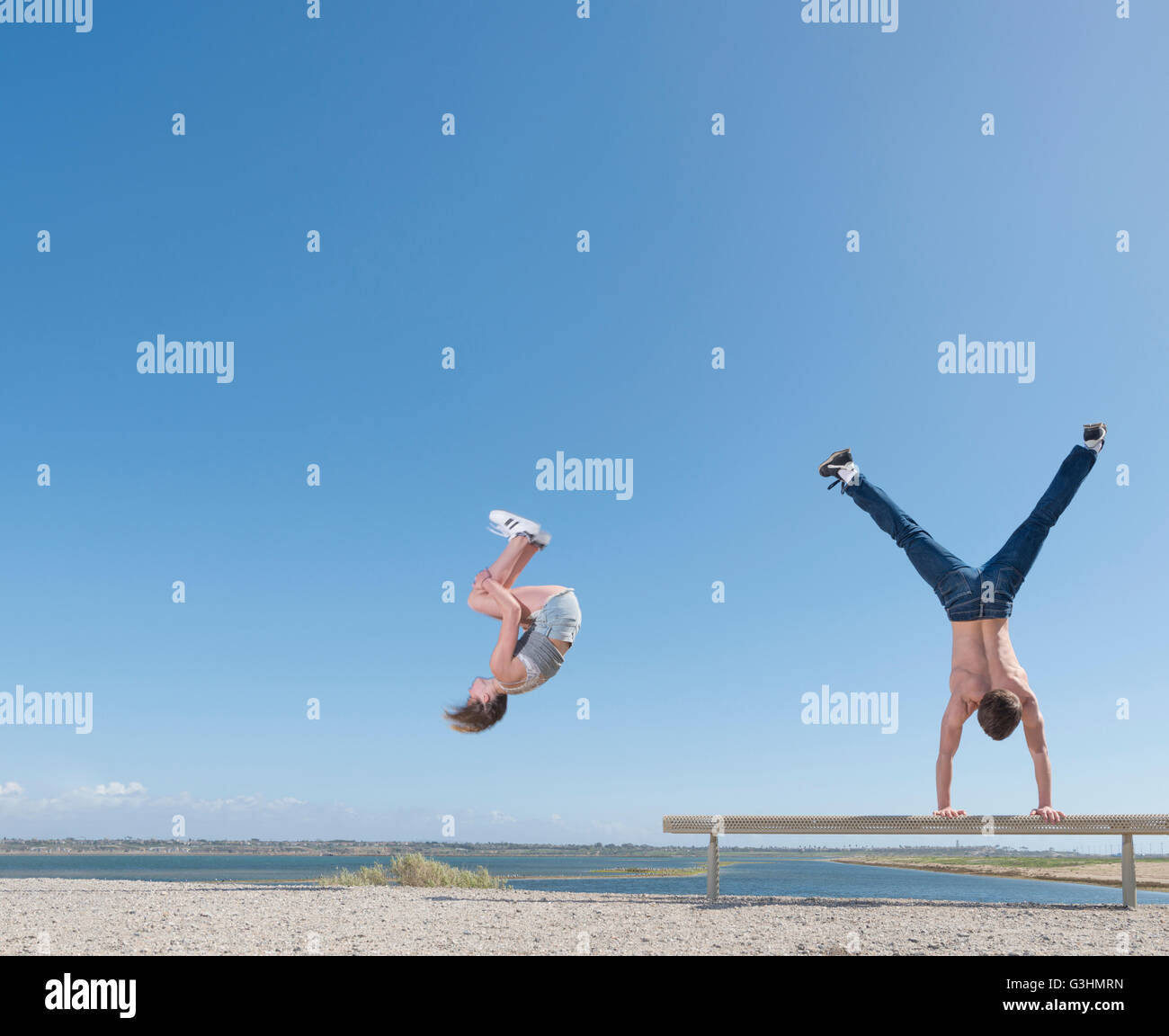 Girl doing somersault mid air hi-res stock photography and images - Alamy