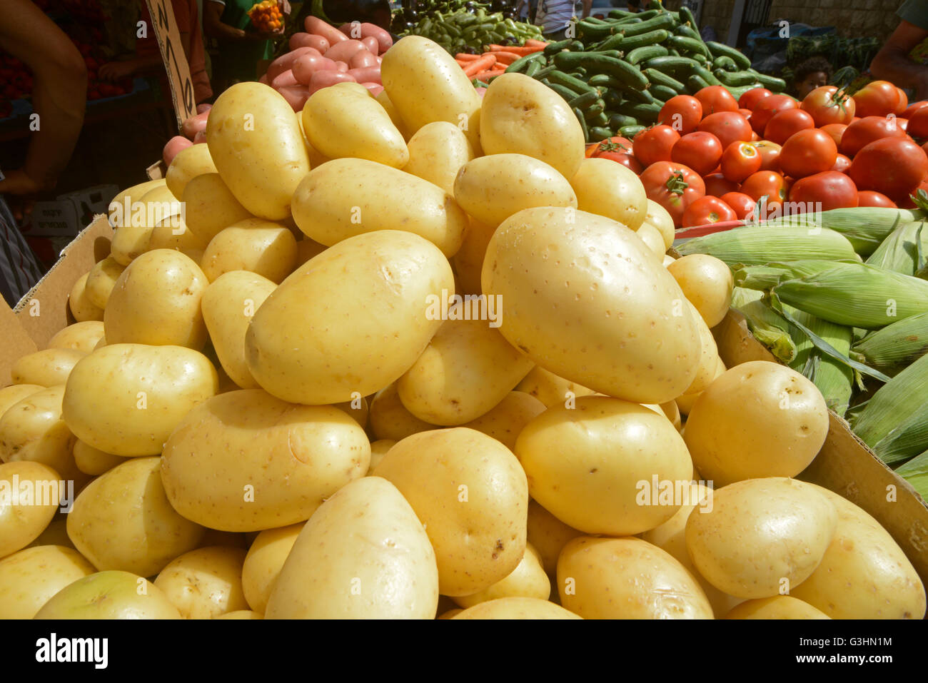fresh potatoes and vegetables on a market stall Stock Photo - Alamy