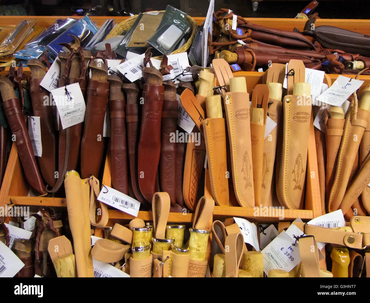 Knife with wooden handle and leather casing Stock Photo - Alamy