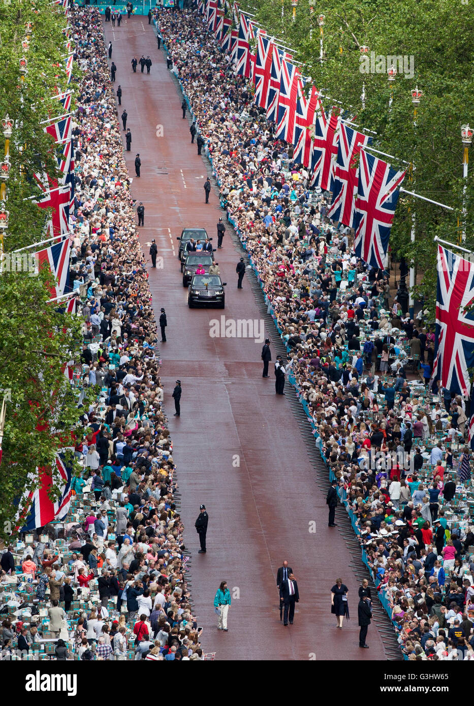 Queen Elizabeth II and the Duke of Edinburgh lead a convoy of cars ...