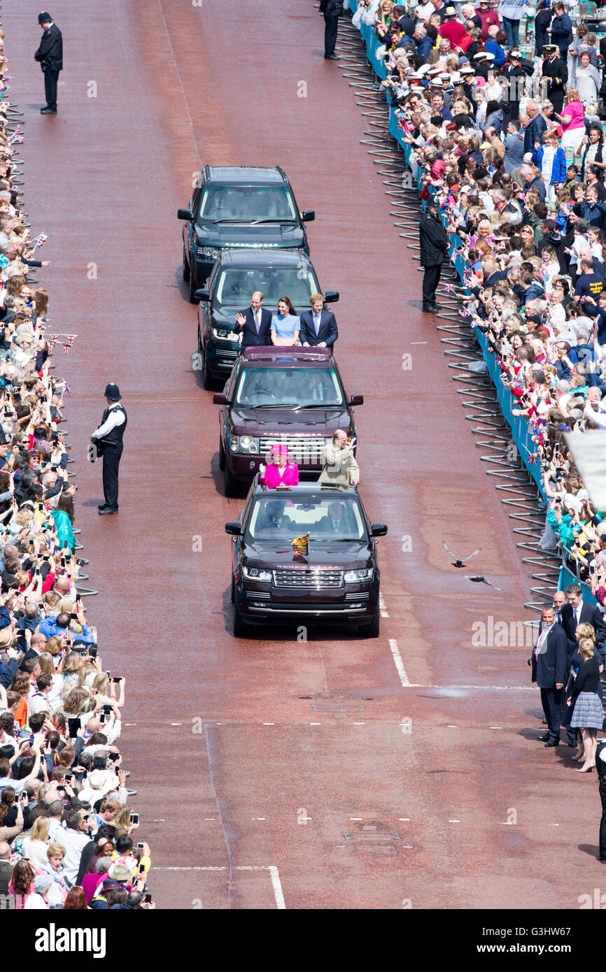 Queen Elizabeth II and the Duke of Edinburgh lead a convoy of cars ...