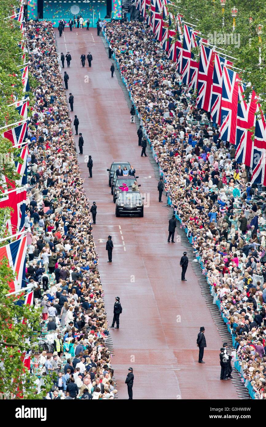Queen Elizabeth II and the Duke of Edinburgh lead a convoy of cars ...