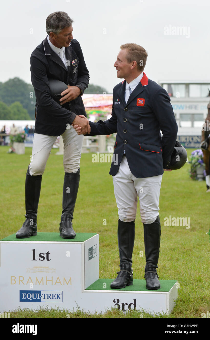 Oliver Townend (right) shakes hands with winner Andrew Nicholson after ...